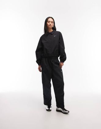 Nike Pantalon droit tiss&eacute; - Noir