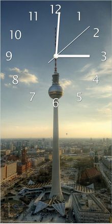 Wallario Design-Wanduhr Fernsehturm Berlin mit Panoramablick über die Stadt aus Glas, Motiv-Uhr Größe 30 x 60 cm, weiße Zeiger