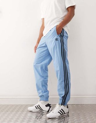 adidas Originals Firebird - Pantalon de surv&ecirc;tement - Bleu et noir