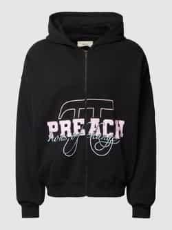 &raquo;Preach&laquo; Oversized Sweatjacke mit Label-Print