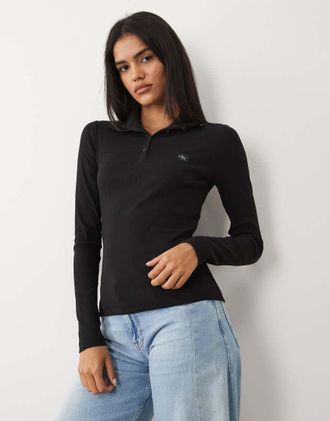 Calvin Klein Jeans Top col montant &agrave; manches longues et col tunisien avec &eacute;tiquette tiss&eacute;e - Noir