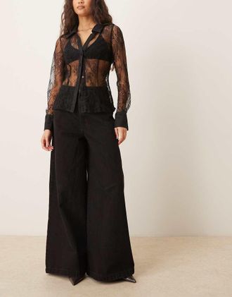Never Fully Dressed Palazzo-Jeans in Schwarz mit weitem Bein