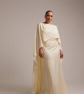 Asos Curve ASOS DESIGN Curve - Robe de mari&eacute;e longue &agrave; dos &eacute;chancr&eacute; et cape superpos&eacute;e - Ivoire-Blanc