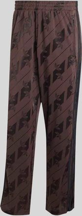 adidas Originals Relaxed Fit Sweathose mit Allover-Logo-Print