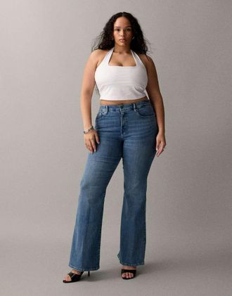 Good American Good Legs - Schlagjeans in mittelblauer Waschung