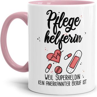Tassendruck Berufe-Tasse Superheldin Pflegehelferin - Kaffee-Tasse mit Spruch/Arbeit/Job/Lustig/Geschenk-Idee - Innen & Henkel Rosa