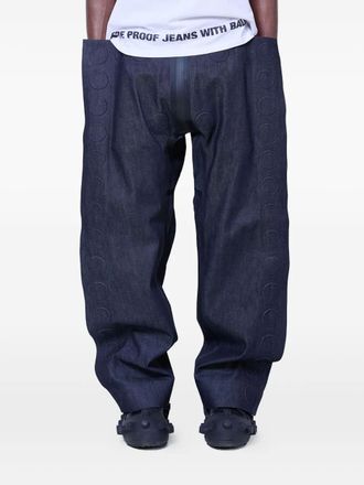 Walter Van Beirendonck jean à détails embossés - Bleu