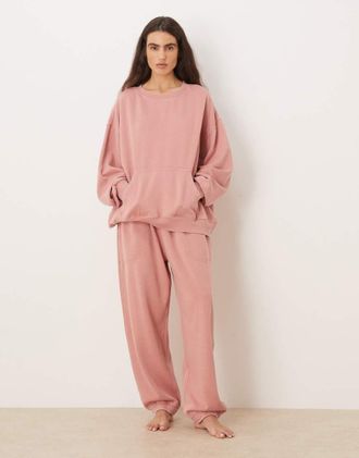 Free People Slow It Down - Weite, kuschelige Jogginghose in gedecktem Rosa