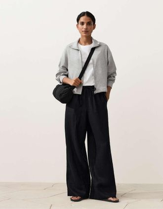 Oysho Pantalon droit en lin avec surpiq&ucirc;res - Noir