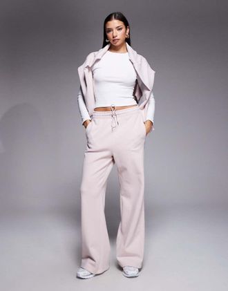 Nike Phoenix Fleece - Pantalon de jogging ample &agrave; taille haute - Rose