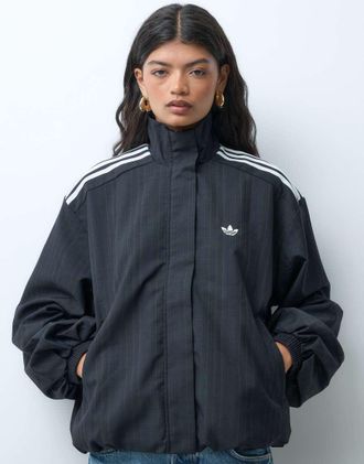 adidas Originals Firebird haut de surv&ecirc;tement ample &agrave; carreaux noir