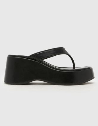 schuh Tonio - Zehenstegsandalen in Schwarz mit flacher Plateausohle