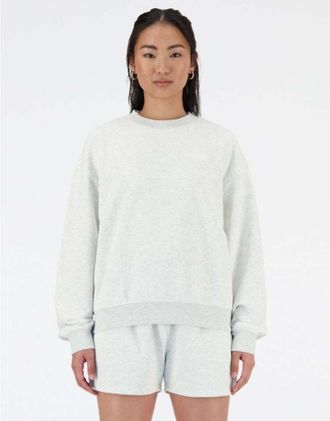 New Balance Sport Essentials - Pullover aus French-Terry in Grau mit Rundhalsausschnitt