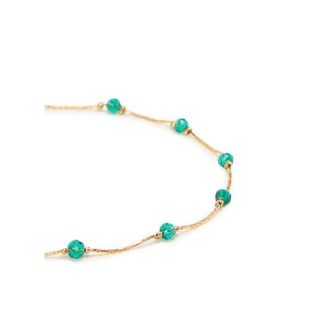 Au Printemps Paris Bracelet avec perles en verre