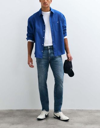 Lacoste jean slim indigo en denim d&eacute;lav&eacute; moyen-Bleu