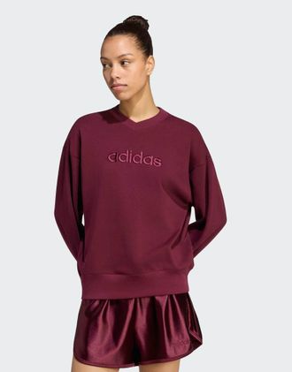 adidas Seasonal essentials Satin-Sweatshirt mit V-Ausschnitt in Burgunderrot