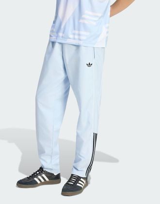 adidas Originals Pantalon de surv&ecirc;tement avec demi-bandes - Bleu ciel cristal