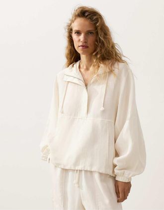Oysho Oysho - Sweat &agrave; col zipp&eacute; en lyocell et 24% lin m&eacute;lang&eacute;s avec poche avant - &Eacute;cru p&acirc;le-Neutral