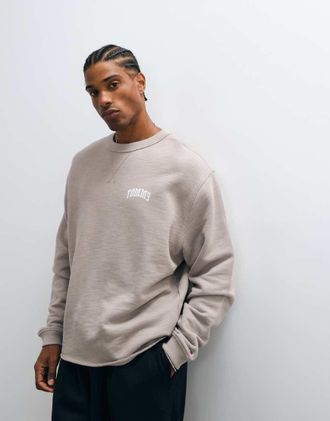 Tommy Jeans sweatshirt col rond coupe relaxed avec logo NYC en stone-Neutre
