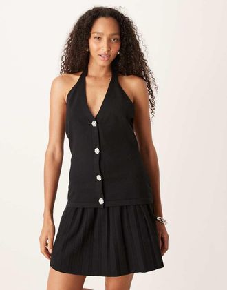 Amy Lynn Neckholder-Oberteil aus Strick in Schwarz mit Strassknöpfen