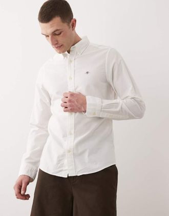 GANT Chemise Oxford coupe slim &agrave; logo embl&eacute;matique - Blanc