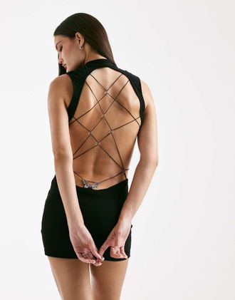 I.AM.GIA Larisa - Robe courte et moulante &agrave; fente goutte deau avec dos ouvert &agrave; lani&egrave;res crois&eacute;es et papillon m&eacute;tallique - Noir