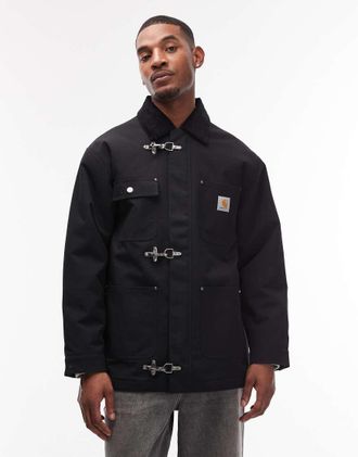 Carhartt Work in Progress Adair - Mantel aus schwarzem Cordura mit Feuerwehrschnallen