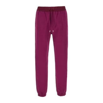 Saint Laurent Trackpants aus Baumwolle mit Sticklogo - - Trousers - Herren - Rosa - M