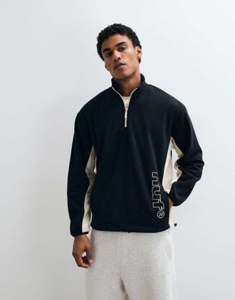 HUF polaire Basecamp &agrave; empi&egrave;cements, quart de zip, noir