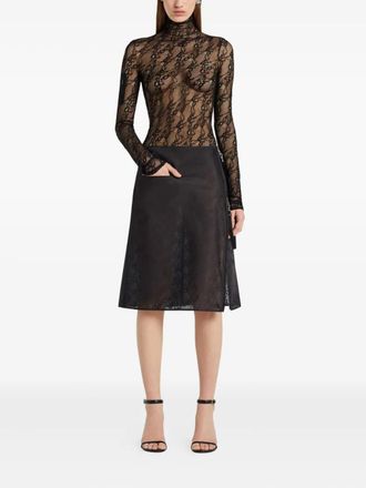 Courr&egrave;ges Schwarzes Stretch-Spitzenoberteil