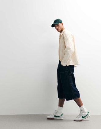 Carhartt Work in Progress OG - Loose-Fit-Jorts in blauer Rinse-Waschung mit doppelter Stofflage im Kniebereich