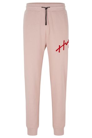 HUGO BOSS Herren Drog Jogginghose aus Baumwoll-Terry mit handgeschriebener Logo-Stickerei Hellrosa XS