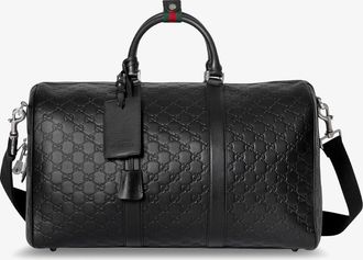 Gucci Coated canvas GG Emblem travel bag with GG motif - GUCCI - gender_Man