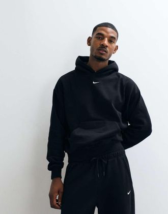 Nike Solo zentraler Swoosh-Logo Oversize-Fleece-Kapuzenpullover in Schwarz
