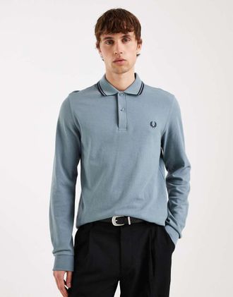 Fred Perry Lang&auml;rmliges Polohemd in Blau mit schwarzen Zierstreifen