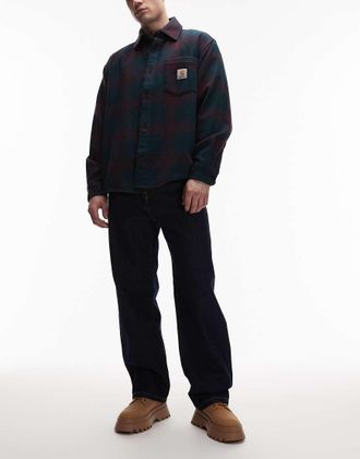 Carhartt Work in Progress Landon - Schmal zulaufende Denim-Jeans in Indigoblau mit lockerem Schnitt