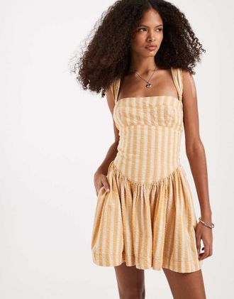 Free People Laurel - Minikleid mit gestreiftem Schottenkaromuster in neutralen Farben mit tiefer Taille-Bunt