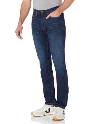 Amazon Essentials Herren Stretchjeans mit lockerer Passform (in Übergrößen erhältlich) - Auslauffarben, Indigo Waschung, 46W / 34L