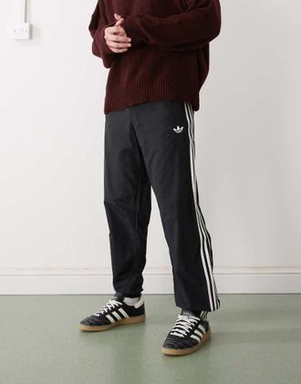 adidas Originals Firebird - Pantalon de surv&ecirc;tement tiss&eacute; - Noir