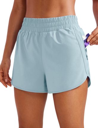 CRZ YOGA Damen Kurz Sporthose Laufhose High Waist Fitness Sport Shorts Kurze Hose mit Reißverschlusstasche Hellgraublau 36
