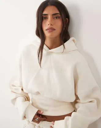 KAIIA Hoodie-Kombiteil mit hohem Baumwollanteil, taillierter Taille und Schn&uuml;rdetail im Korsettstil in Buttercreme-Wei&szlig;