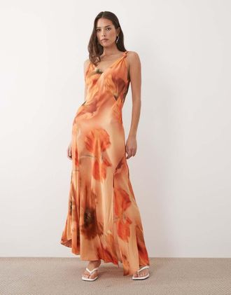 Never Fully Dressed Sofia - Robe longue coup&eacute;e en biais &agrave; imprim&eacute; fleuri flou avec bretelles nou&eacute;es - Orange
