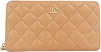 Chanel Portefeuille long Timeless Classic en cuir dagneau doccasion - Femme - Pre-owned - Beige - Taille: ONE Size