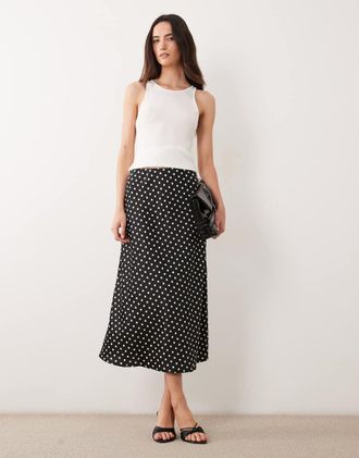 Vero Moda jupe midi en satin &agrave; pois noirs et cr&egrave;me