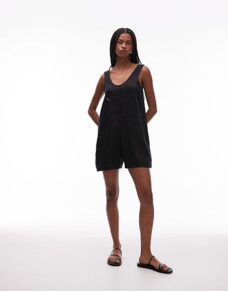 Arket Strand-Playsuit aus reinem Leinen in Schwarz mit tiefem V-Ausschnitt und Taschendetail