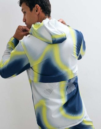 Under Armour veste de running Velociti Storm bleu marine &agrave; imprim&eacute; r&eacute;fl&eacute;chissant