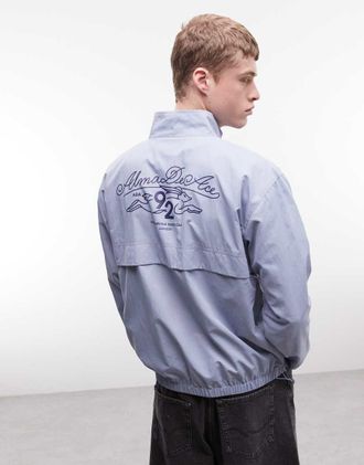 Alma de Ace Alma de Ace - Yenta - Oberteil in Blau mit kurzem Rei&szlig;verschluss und 92-Logoprint hinten