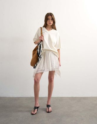 Topshop Mini-jupe &agrave; broderie anglaise avec ourlet mouchoir - Blanc