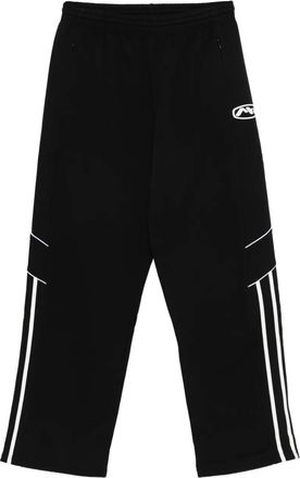 Martine Rose pantalon de jogging &agrave; patch t&ecirc;te de tigre - Noir