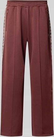 Review Trainingshose mit Biese, aufgesetztem Band und Logo-Bestickung